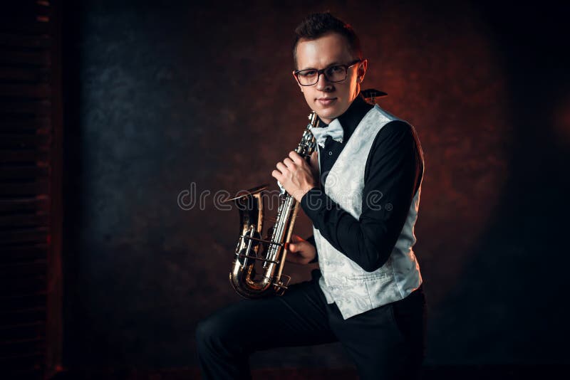 Male Saxophonist Playing in Orchestra Under Blue Sky Stock Photo ...