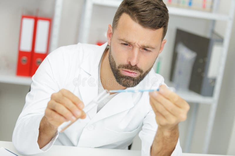Male Scientist Analysing Test Tube Experiment Stock Photo - Image of ...