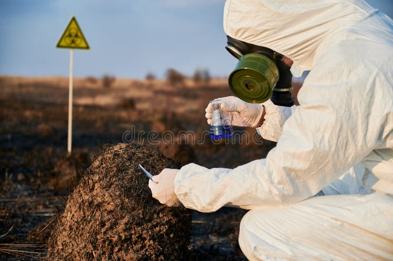 Male Scientist Doing Research Work in Burnt Field. Stock Image - Image ...