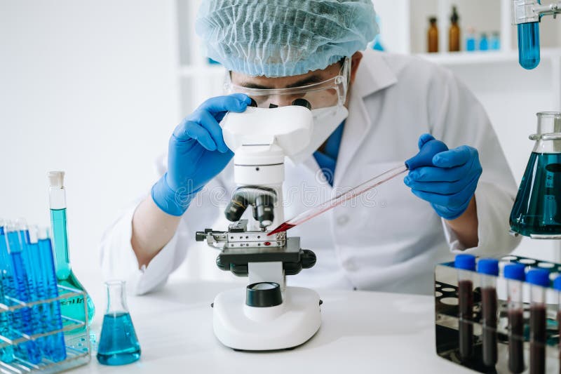 Male Scientist Researcher Conducting an Experiment in Laboratory Stock ...
