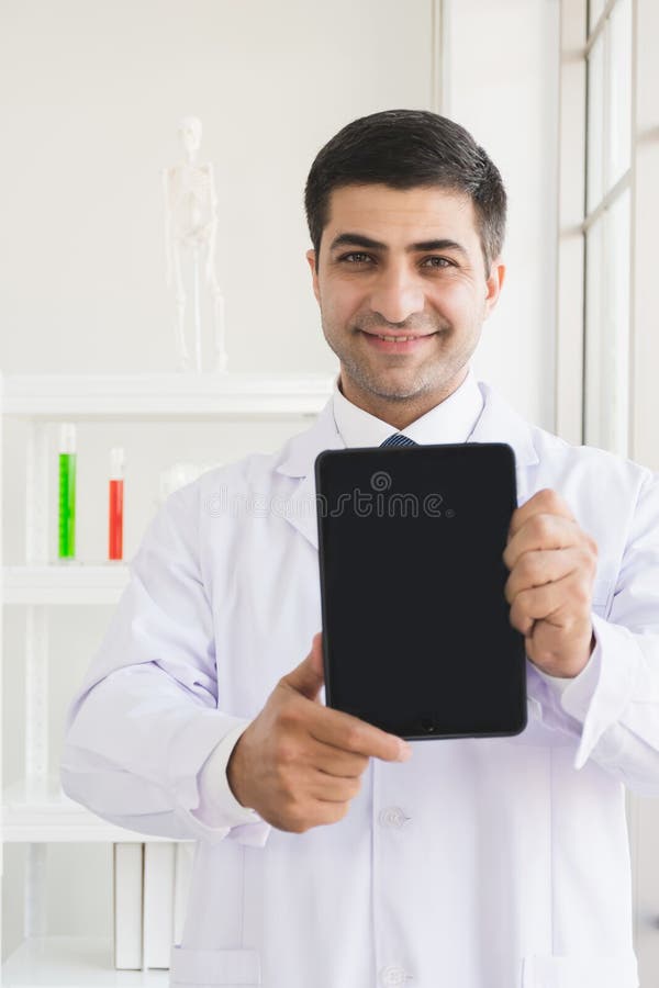 A Male Scientist Smile and Show a Tablet Computer Stock Photo - Image ...