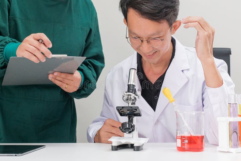 Male Scientist Standing with Techer in Lab Worker Making Medical Stock ...