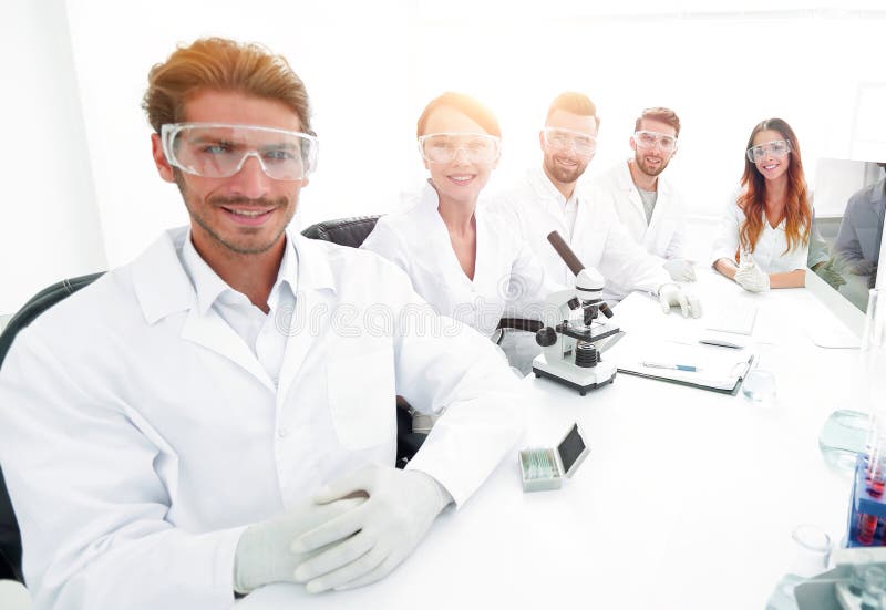 Male Scientist and the Team in the Lab. Stock Image - Image of ...