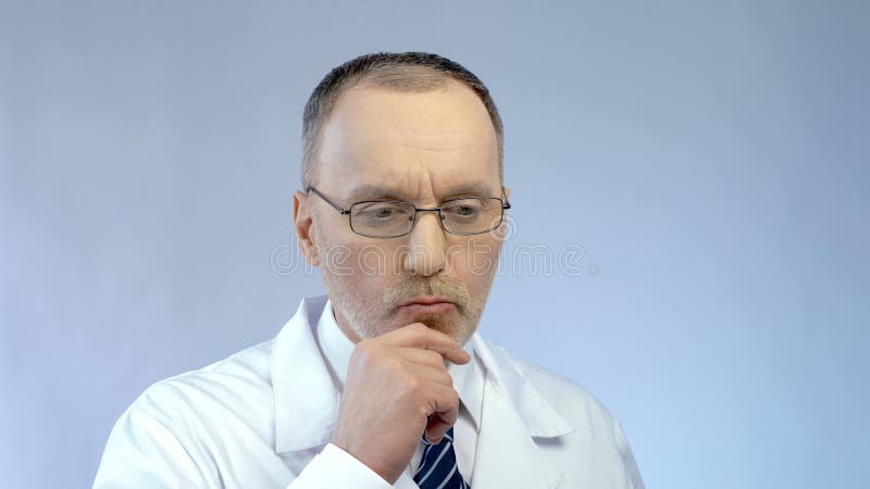 Male Scientist Thinking Over Project, Solving Problem in Medical ...