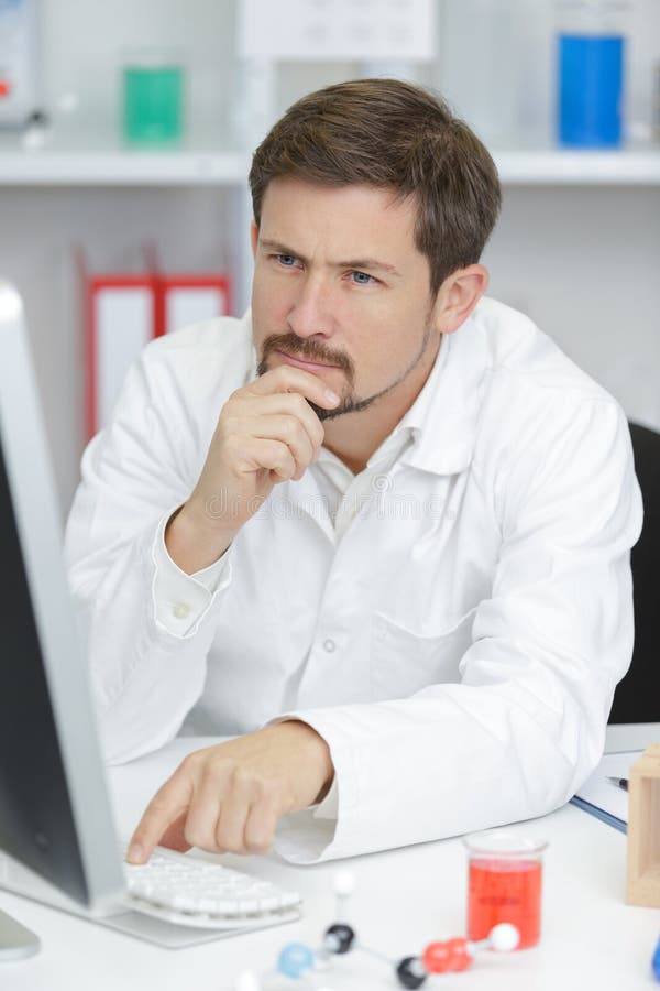 Male Scientist Using Computer in Laboratory Stock Photo - Image of ...