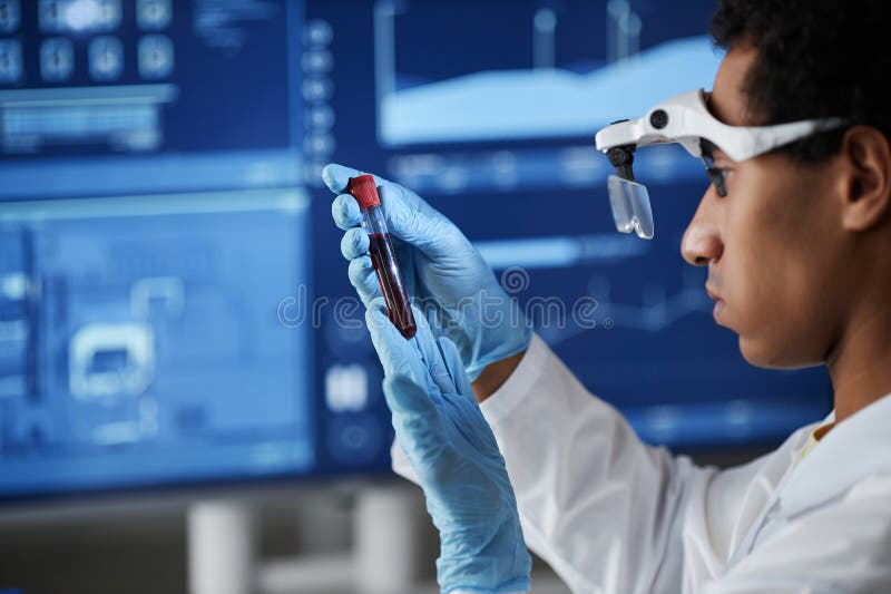 Male Scientist Wearing Face Shield in Laboratory while Doing Blood ...