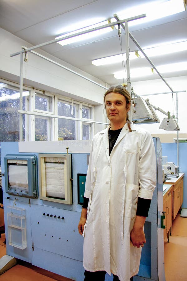 Male Scientist in White Robe Working in Laboratory of Plant Physiology ...