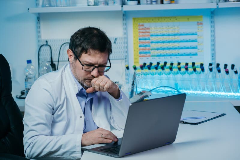 Male Scientist Working in the Laboratory with Laptop Computer and ...