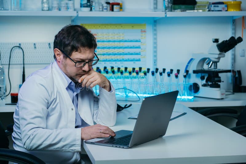 Male Scientist Working in the Laboratory with Laptop Computer and ...