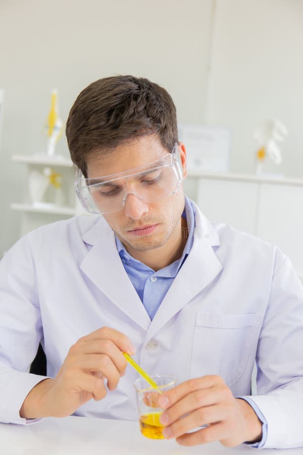 Male Scientist Working in a Science Lab with Various Equipment in the ...