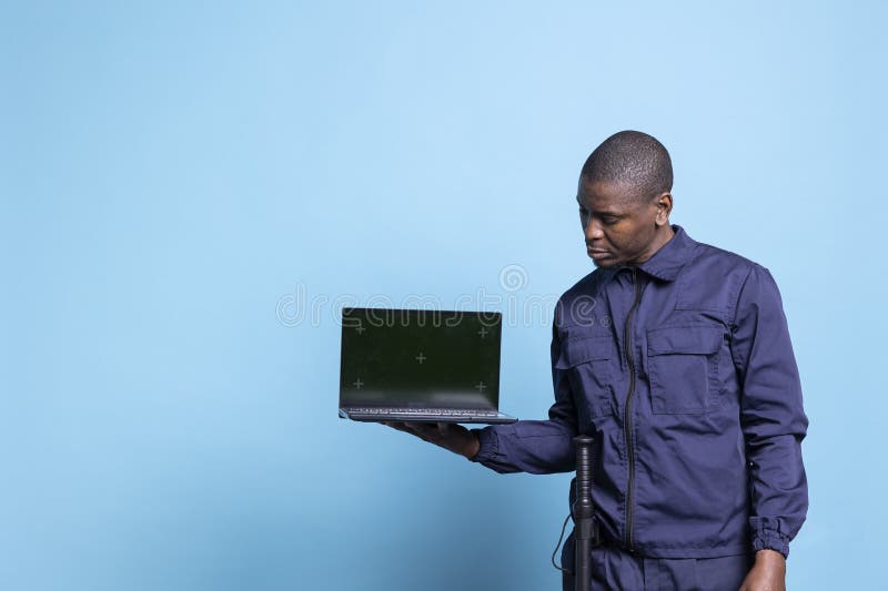 Male Security Agent Pointing at His Laptop Screen with Mockup Stock ...