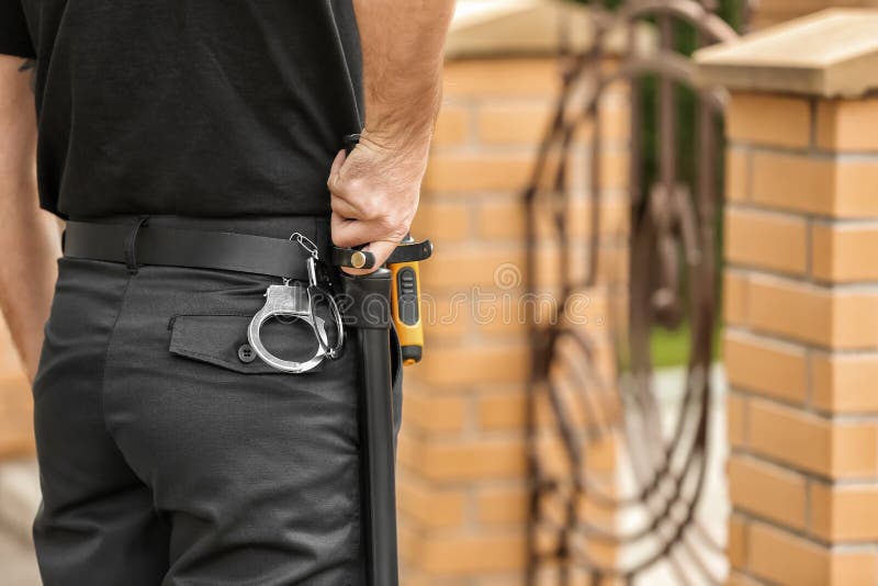 Male Security Guard with Baton Outdoors Stock Photo - Image of safe ...