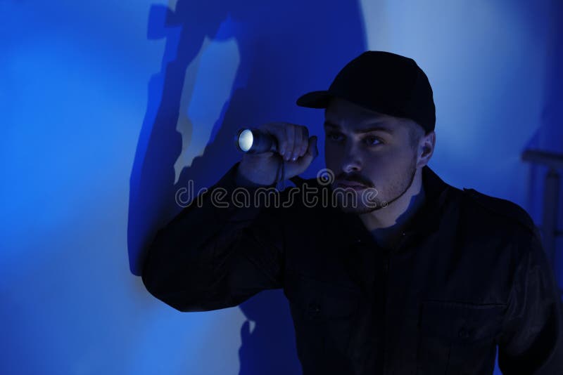 Male Security Guard with Flashlight in Room Stock Image - Image of male ...