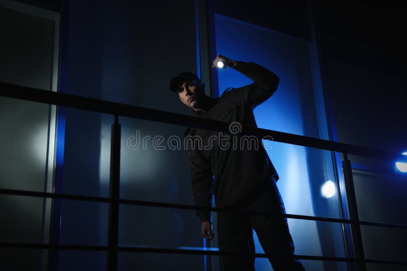 Male Security Guard with Flashlight in Room Stock Image - Image of beam ...