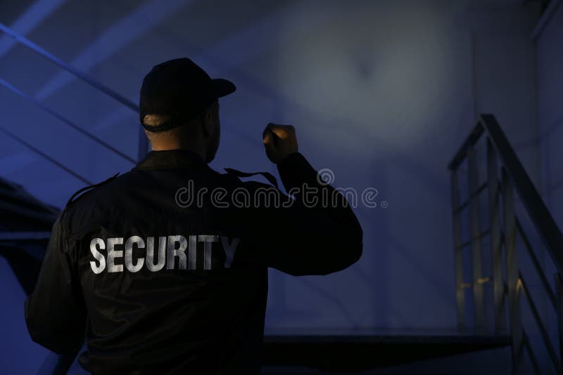 Male Security Guard with Flashlight on Stairs Stock Photo - Image of ...