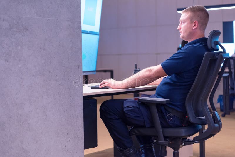 Security Guard Monitoring Modern CCTV Cameras in Surveillance Room ...