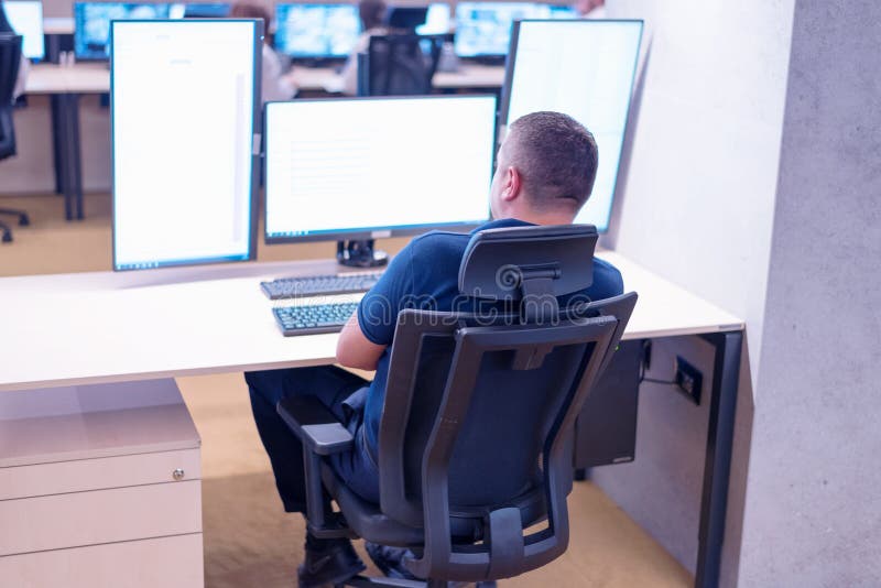 Male Security Guard Operator Talking on the Phone, Calling in the ...