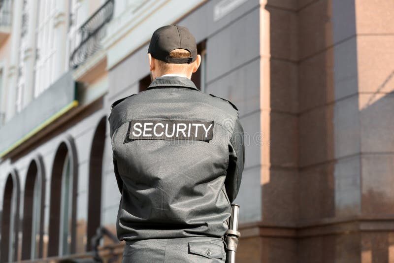 Security Guard Talking by Phone while Monitoring Modern CCTV Cameras in ...