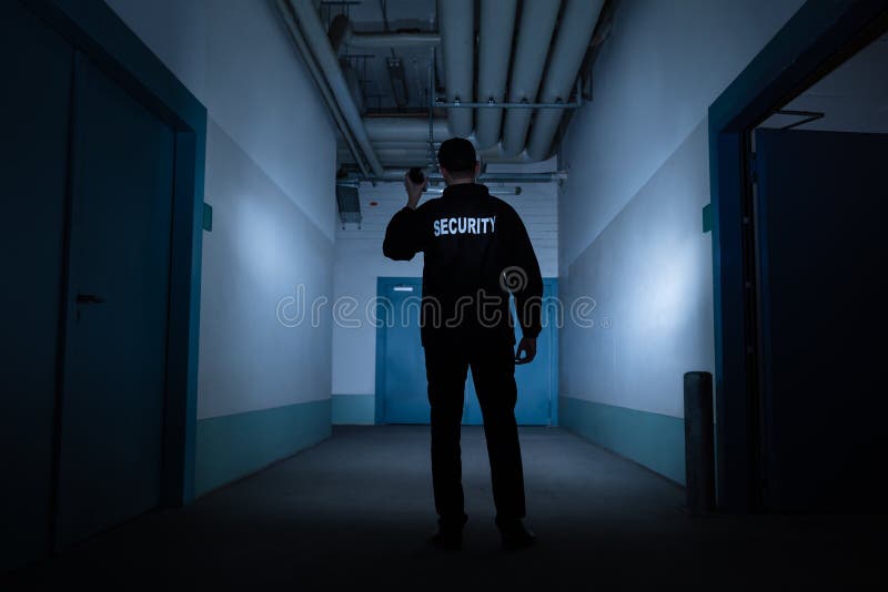 Male Security Guard Standing in Corridor Stock Image - Image of ...