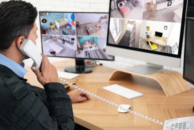Male Security Guard Talking by Telephone Near Monitors Stock Image ...