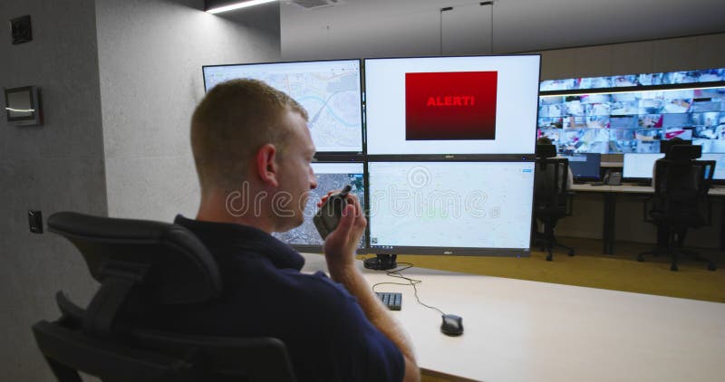 Male Security Guard Using Radio Transmitter in Surveillance Room ...