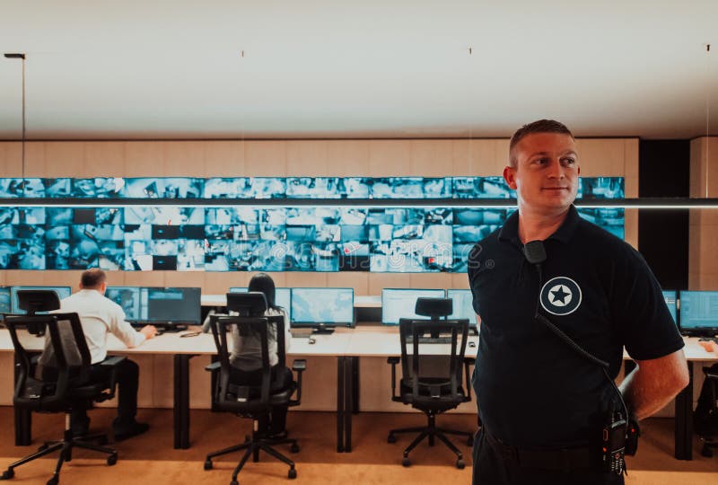 Male Security Operator Working in a Data System Control Room Offices ...