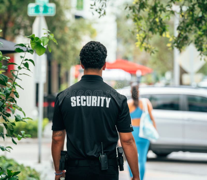 Male Security Personnel Walking on a Street Stock Image - Image of real ...