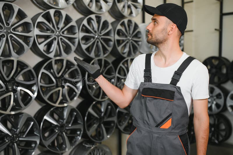 Male Seller in Car Tire Store Stock Image - Image of change, repair ...