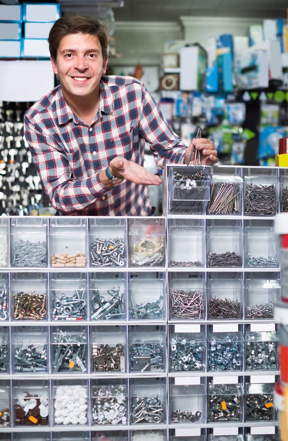 The Seller in the Construction Store Enrol the Goods Stock Photo ...