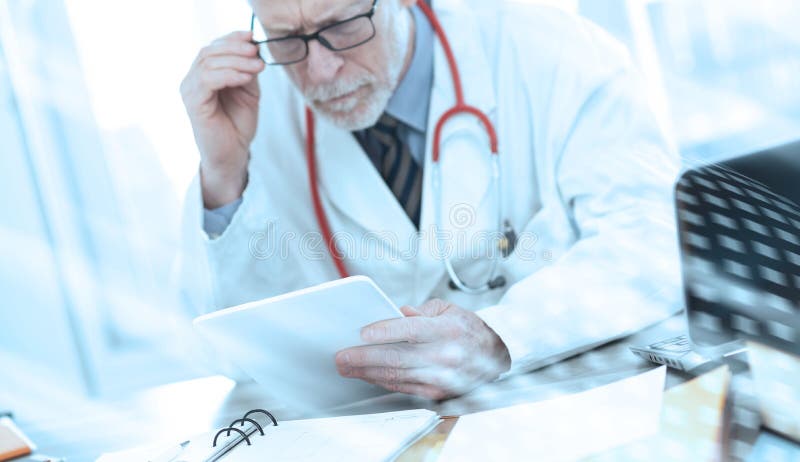 Male Senior Doctor Using Digital Tablet; Light Effect Stock Image ...