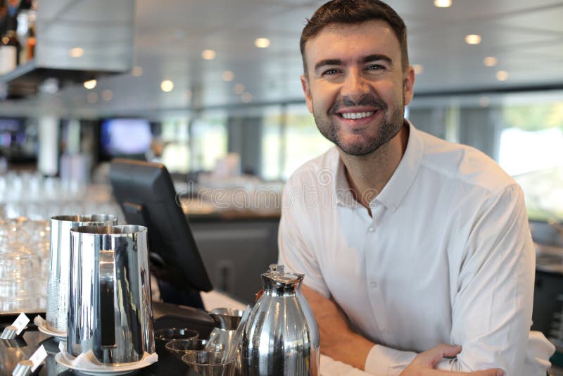 Male Server Smiling Behind the Counter Stock Photo - Image of manager ...