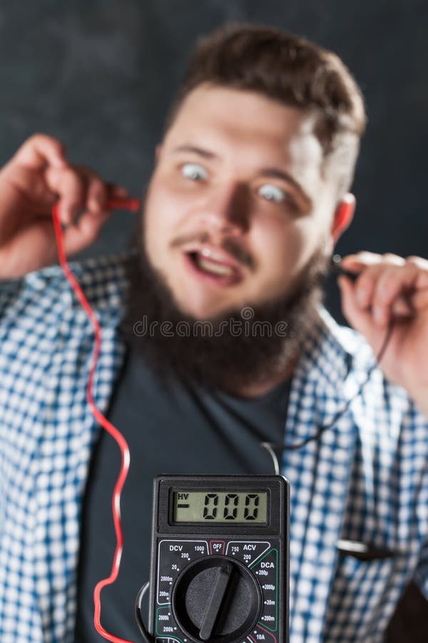 Male Service Engineer Jokes with Multimeter Stock Photo - Image of ...
