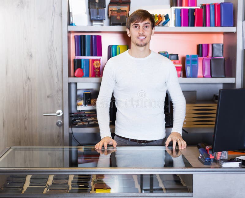 Male Shop Assistant in Wallet Section Stock Image - Image of sale ...