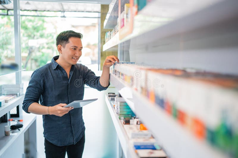 Male Shopkeeper Working in a Grocery Store Stock Image - Image of ...