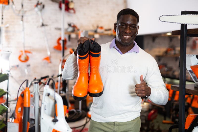 Male Shopper Chooses Rubber Boots at Garden Tool Store Stock Image ...
