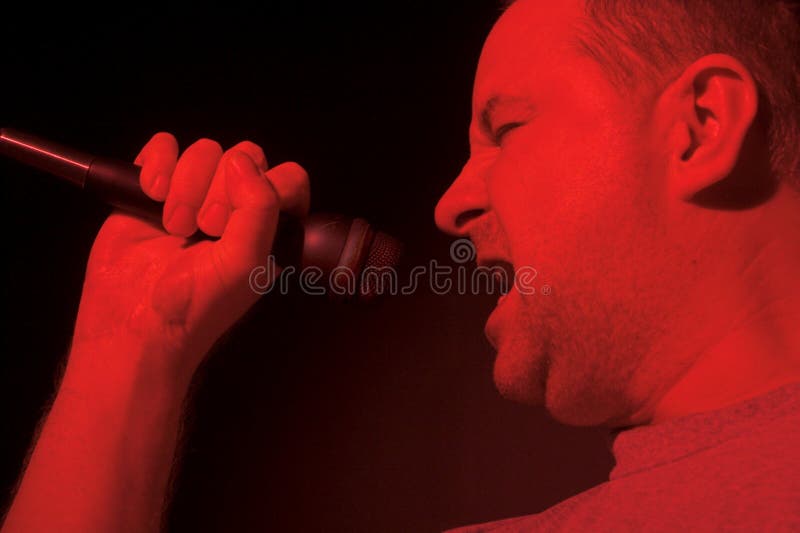 Male Singer with Microphone Stock Photo - Image of side, face: 4813978