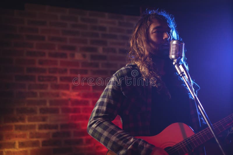 Male Singer Performing with Guitar in Nightclub Editorial Image - Image ...