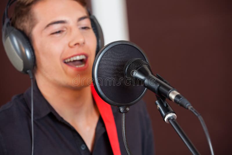 Male Singer Performing in Recording Studio Stock Image - Image of ...