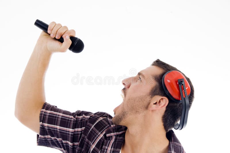 Side View of a Young Man Singing into Microphone Stock Photo - Image of ...