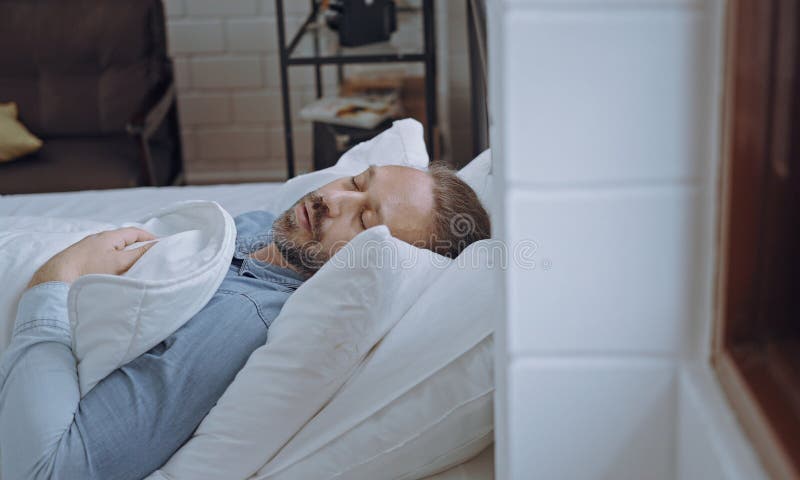 Male Sleeping on Bed in Bedroom at Home Stock Image - Image of ...