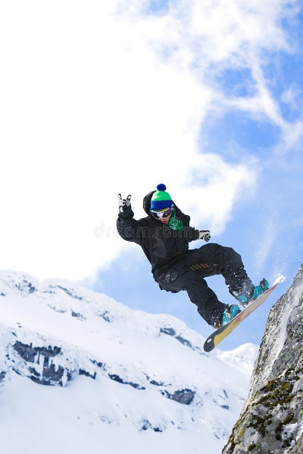 Male Snowboarder Jumping with Snowboard Stock Photo - Image of action ...