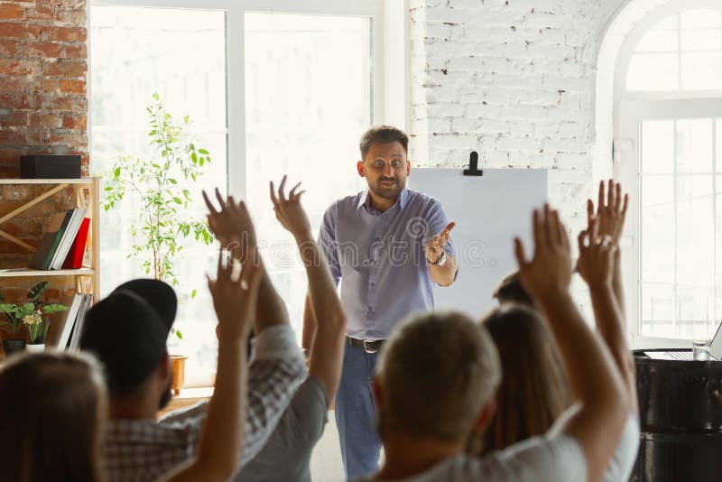 Male Speaker Giving Presentation in Hall at University Workshop Stock ...