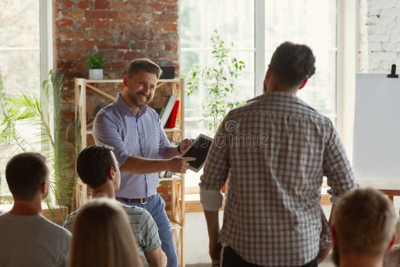 Male Speaker Giving Presentation in Hall at University Workshop Stock ...