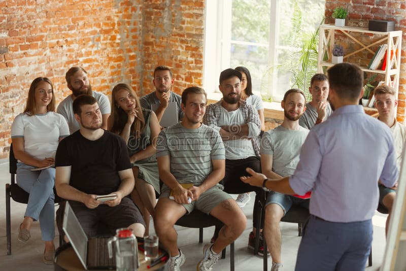 Male Speaker Giving Presentation in Hall at University Workshop Stock ...