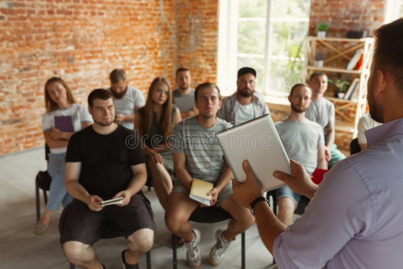 Male Speaker Giving Presentation in Hall at University Workshop Stock ...