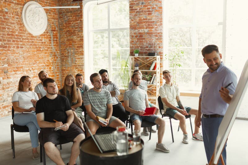 Male Speaker Giving Presentation in Hall at University Workshop Stock ...