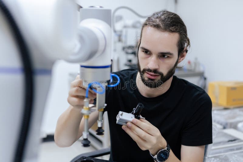 Male Staff Engineer with Robot for Education at Class Room. Education ...