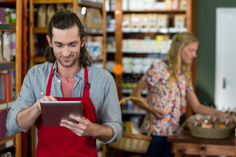 Male Staff Using a Digital Tablet Stock Photo - Image of retail ...