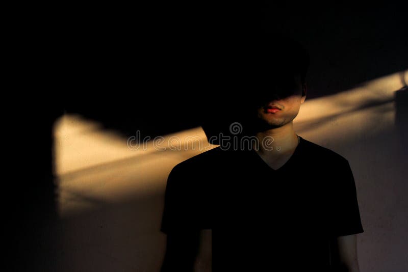 Portrait of Male Standing in the Shadow of Light. Stock Photo - Image ...