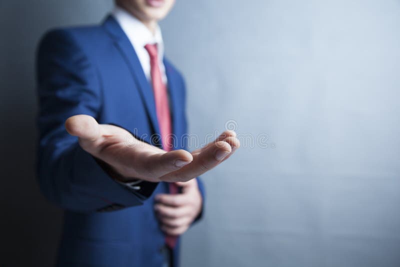 Male is Standing and Shows Outstretched Hand with Open Palm Stock Image ...